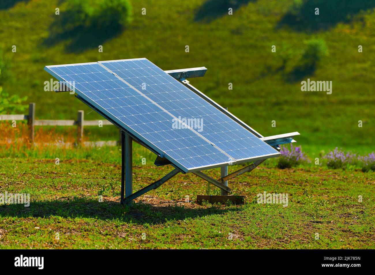 outdoor solar panel installed on legs in nature, green alternative ...
