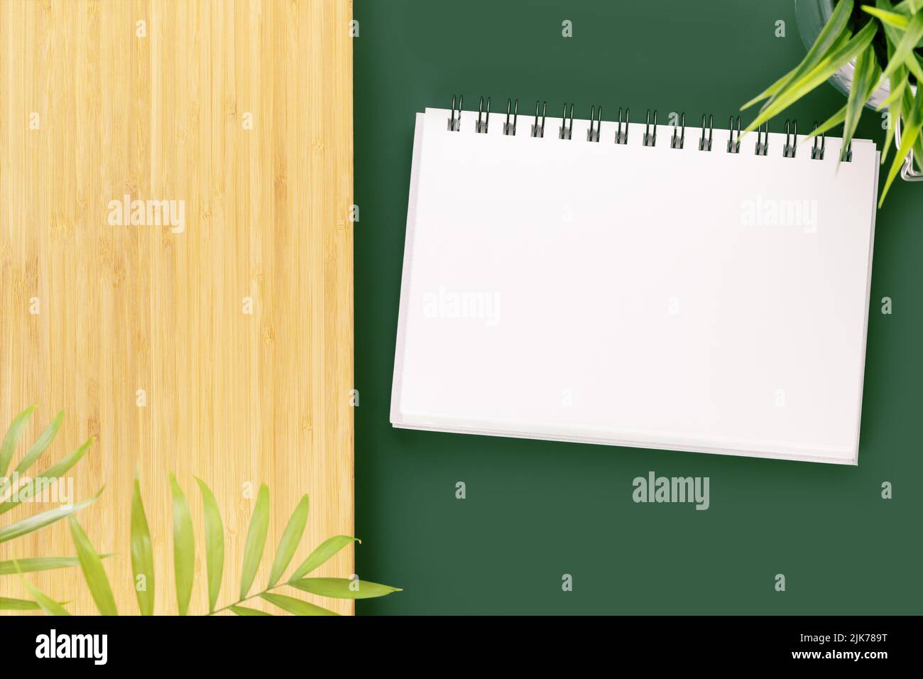 Eco friendly, natural background. Green table with notebook with white ...