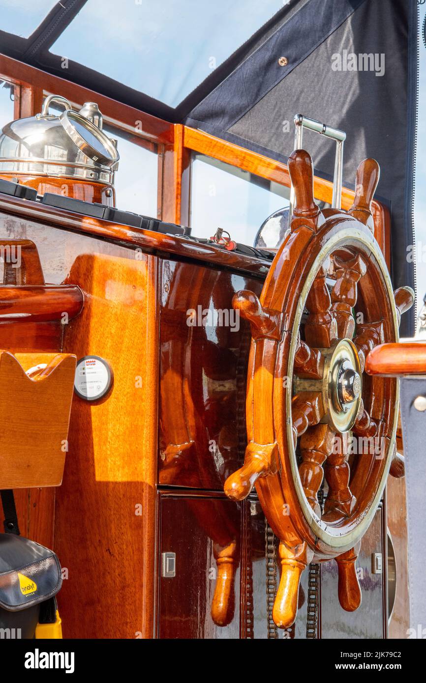 traditional historic wooden ships wheel and navigational instruments on ...