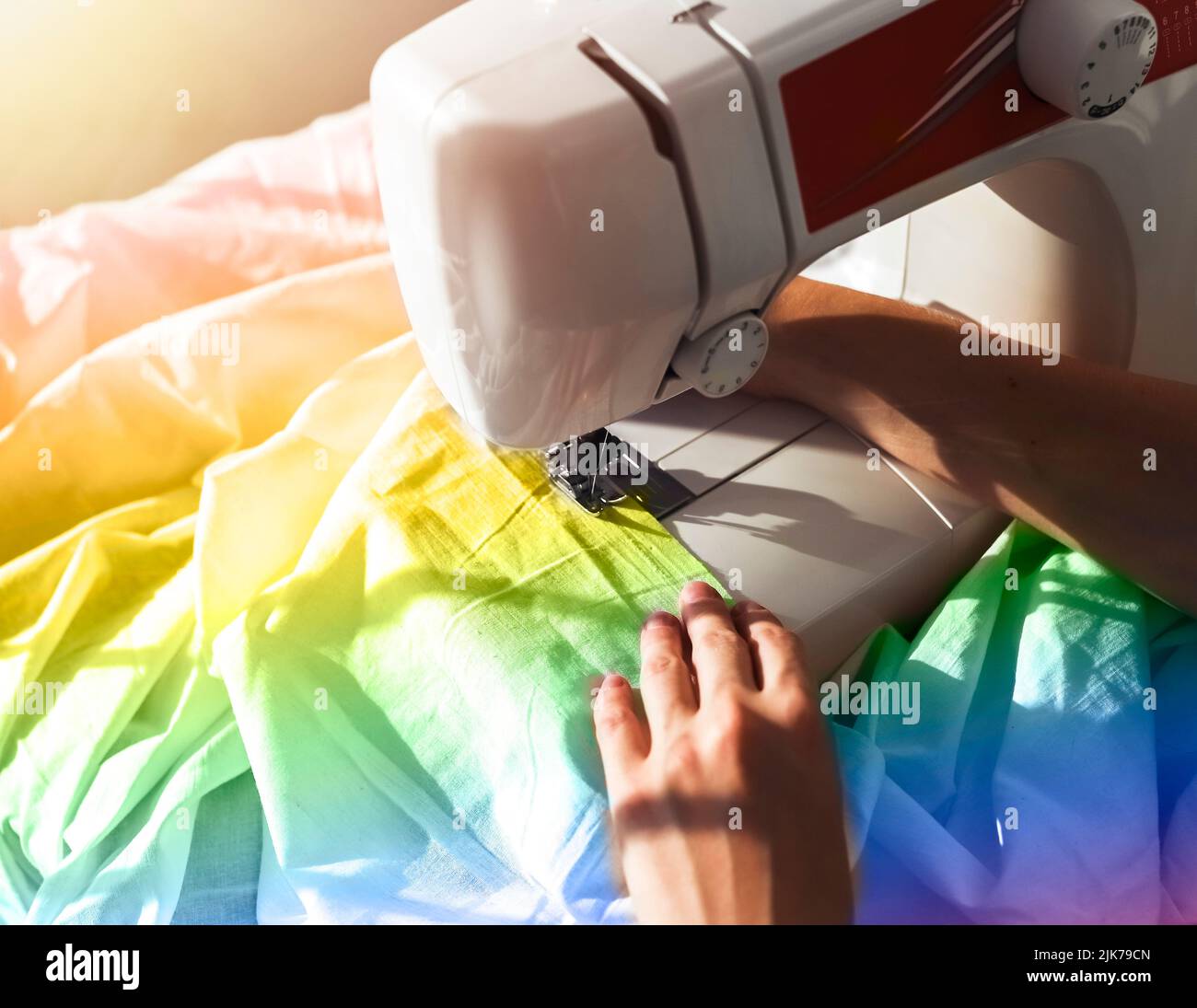 Sewing LGBT, LGBTQ plus fabric flag for pride month. High quality photo ...