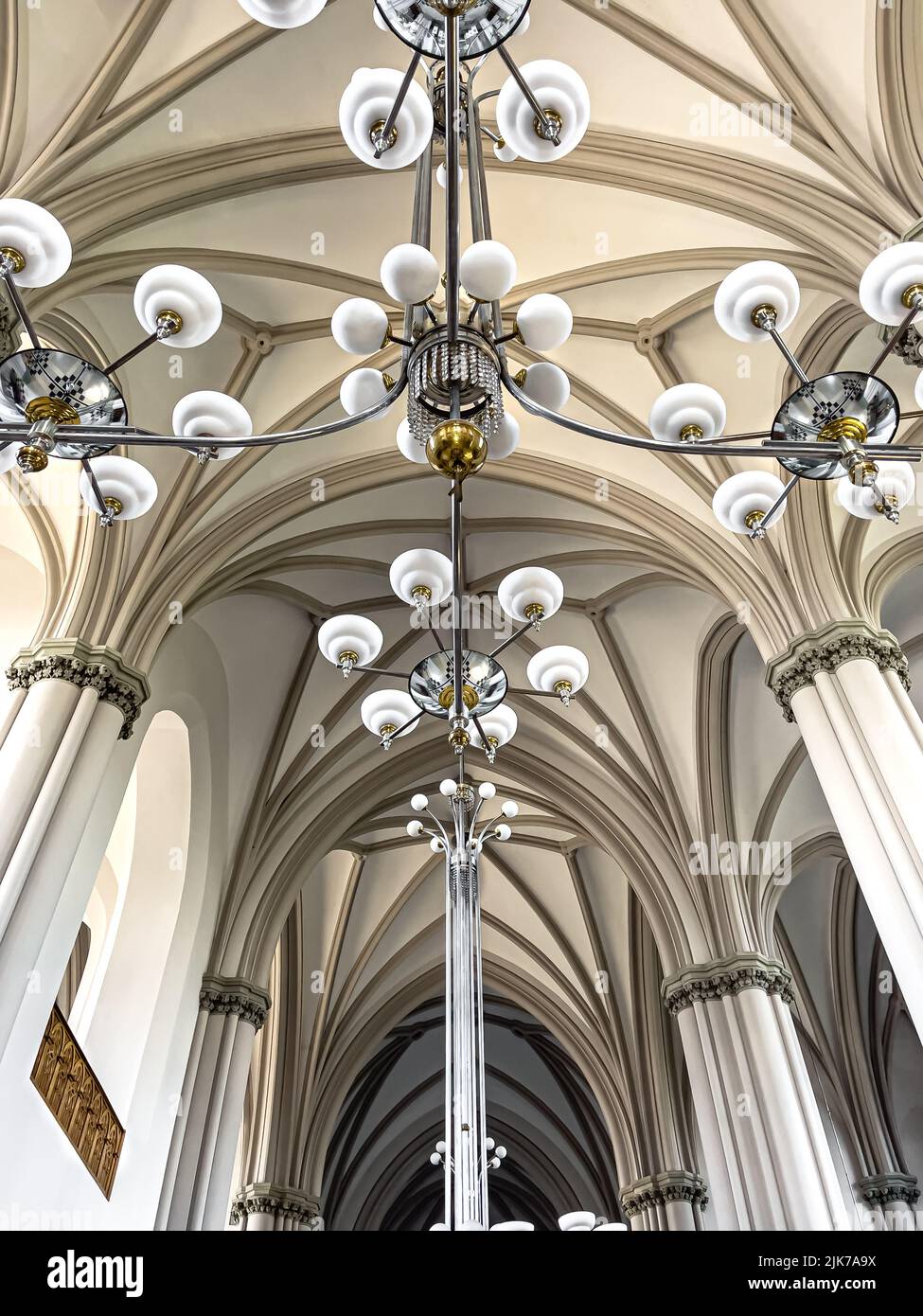 Interior details inside the church, lamps and stained-glass windows ...