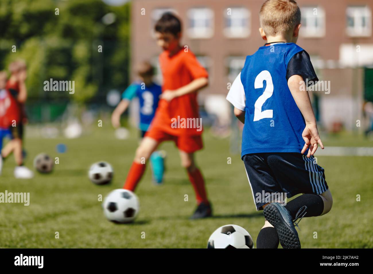Football Summer Traing Camp For School Kids. Soccer Players Running Classic Soccer Ball on ...