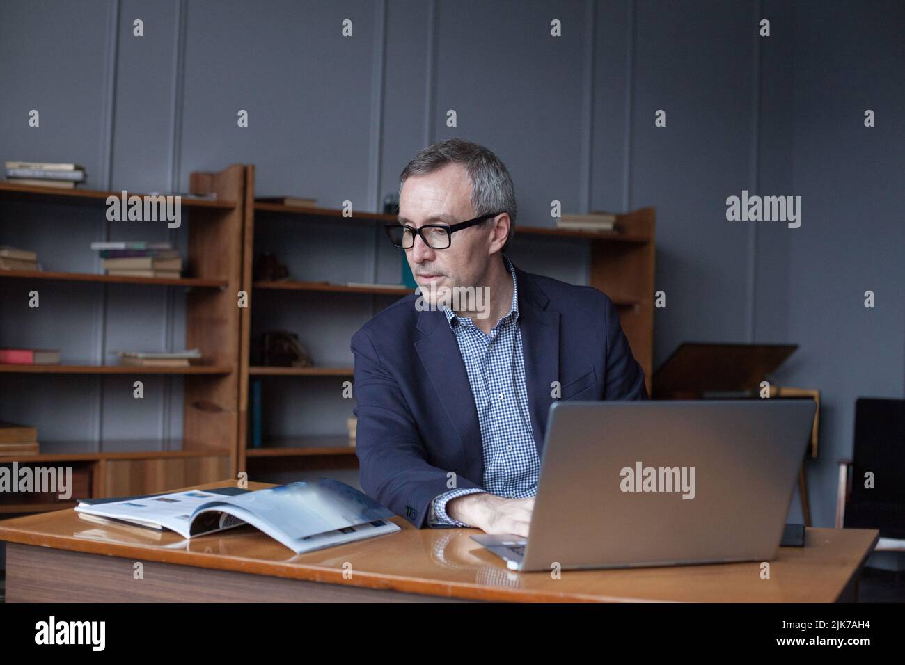 Manager reading a magazine hi-res stock photography and images - Alamy