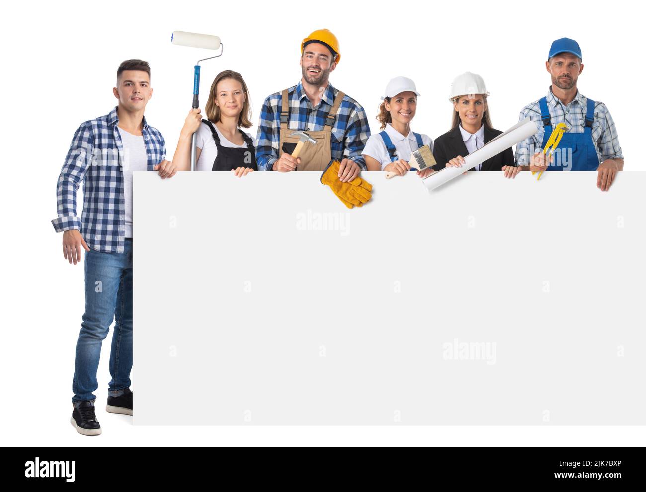 Portrait of happy construction workers holding blank banner isolated ...