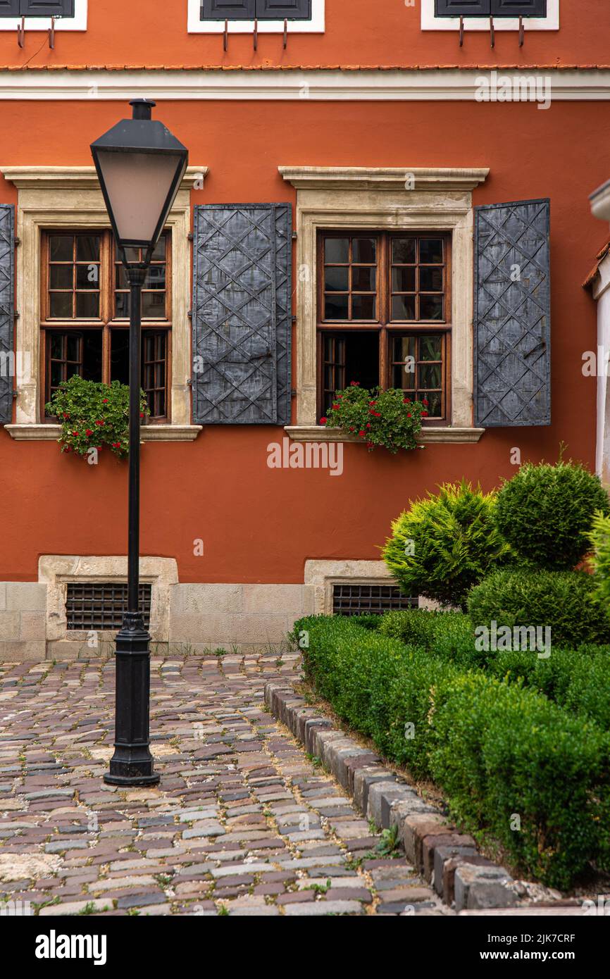 The facade of the building in a beautiful vintage style with windows ...