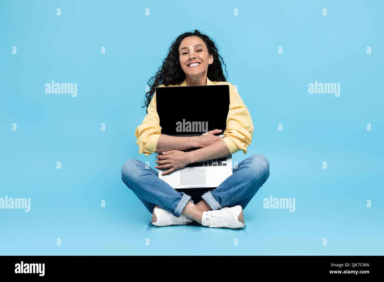 Middle Eastern Woman Hugging Laptop Computer Sitting On Blue Background ...