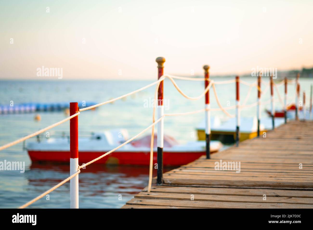 Wooden pier in sea sunset hi-res stock photography and images - Alamy