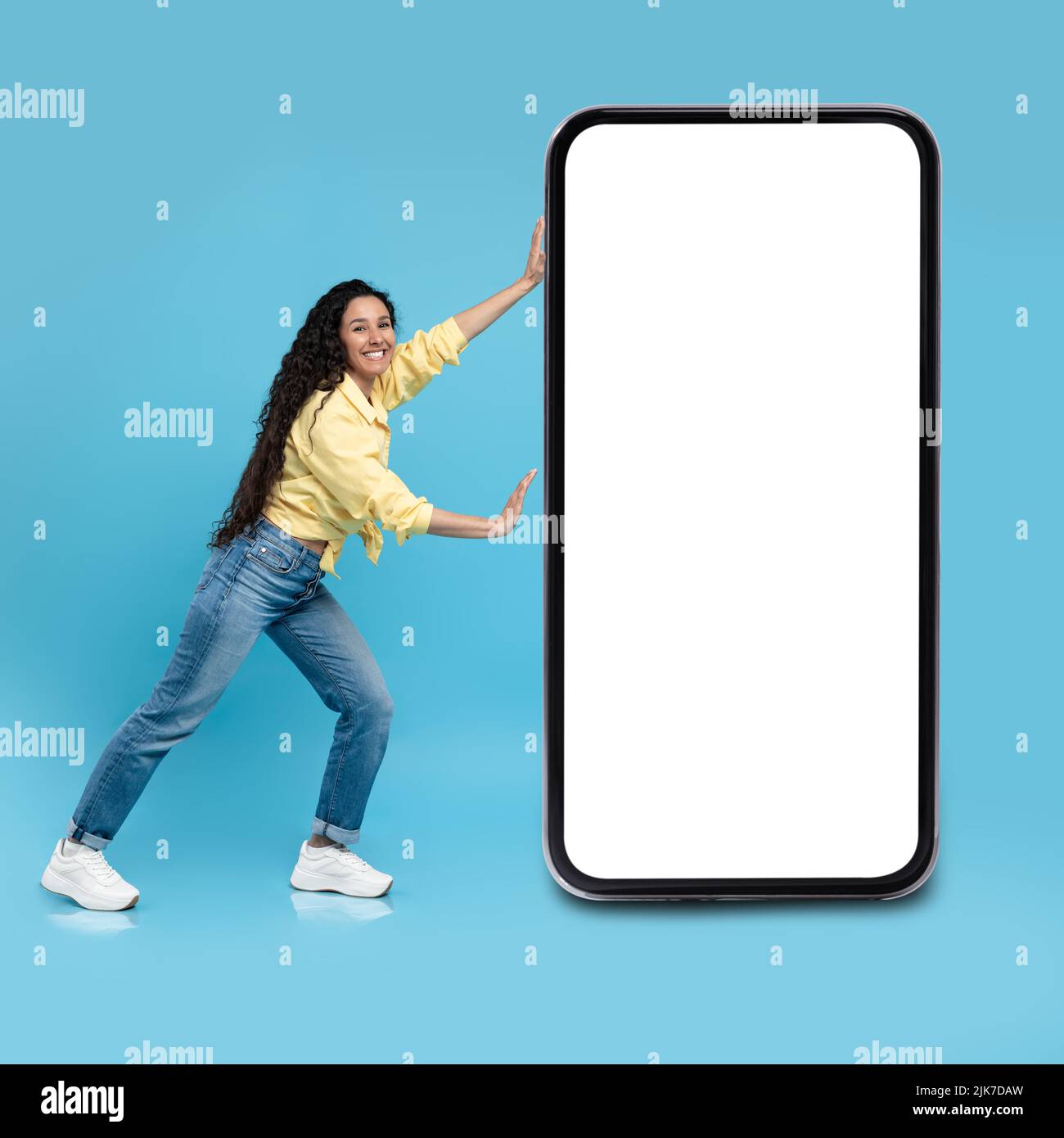 Female Pushing Cellphone With Large Empty Screen On Blue Background ...