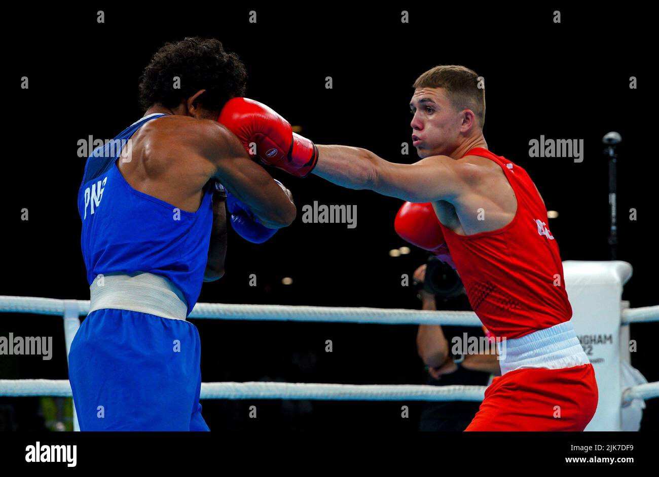 Papua New Guinea's John Ume (Blue) and England's Joseph Tyers (Red) in ...