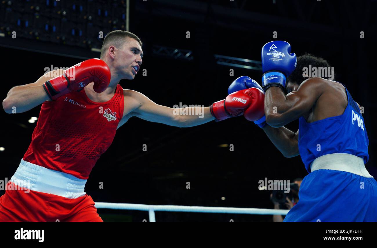 England's Joseph Tyers (Red) and Papua New Guinea's John Ume (Blue) in ...