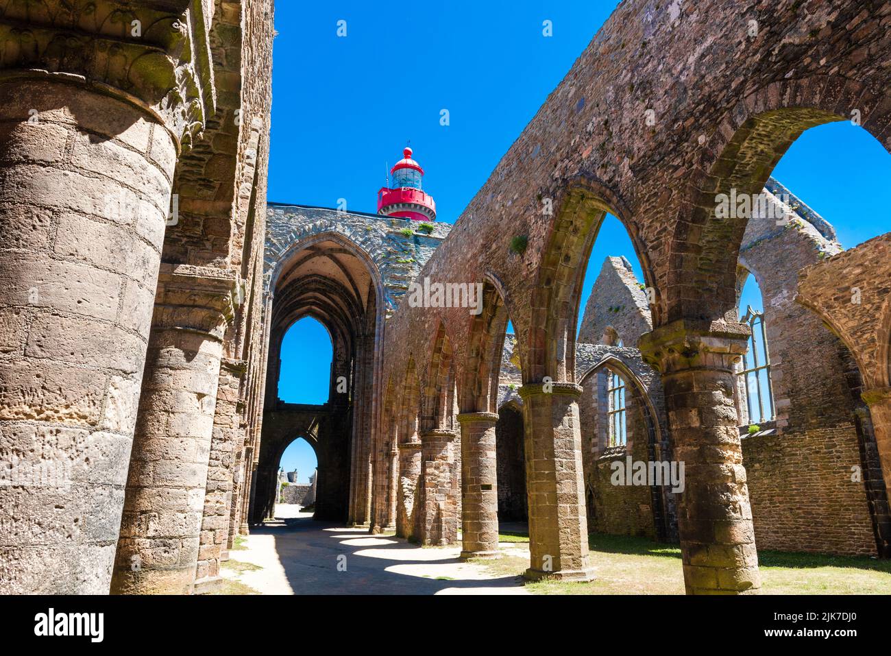 Ruins of Saint Mathieu abbey in Finistere and the top of a lighthouse ...