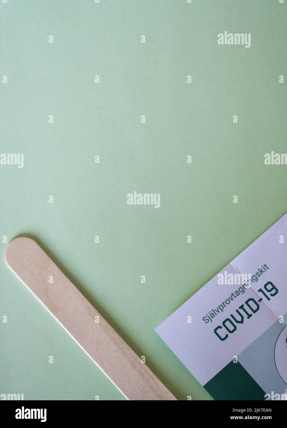 Overhead of covid and corona test on green background Stock Photo - Alamy