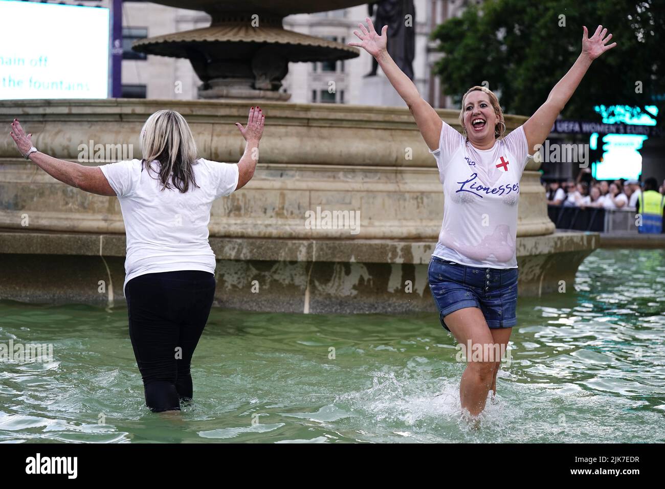 Fans celebrate the final whistle in Trafalgar Square, London, after ...
