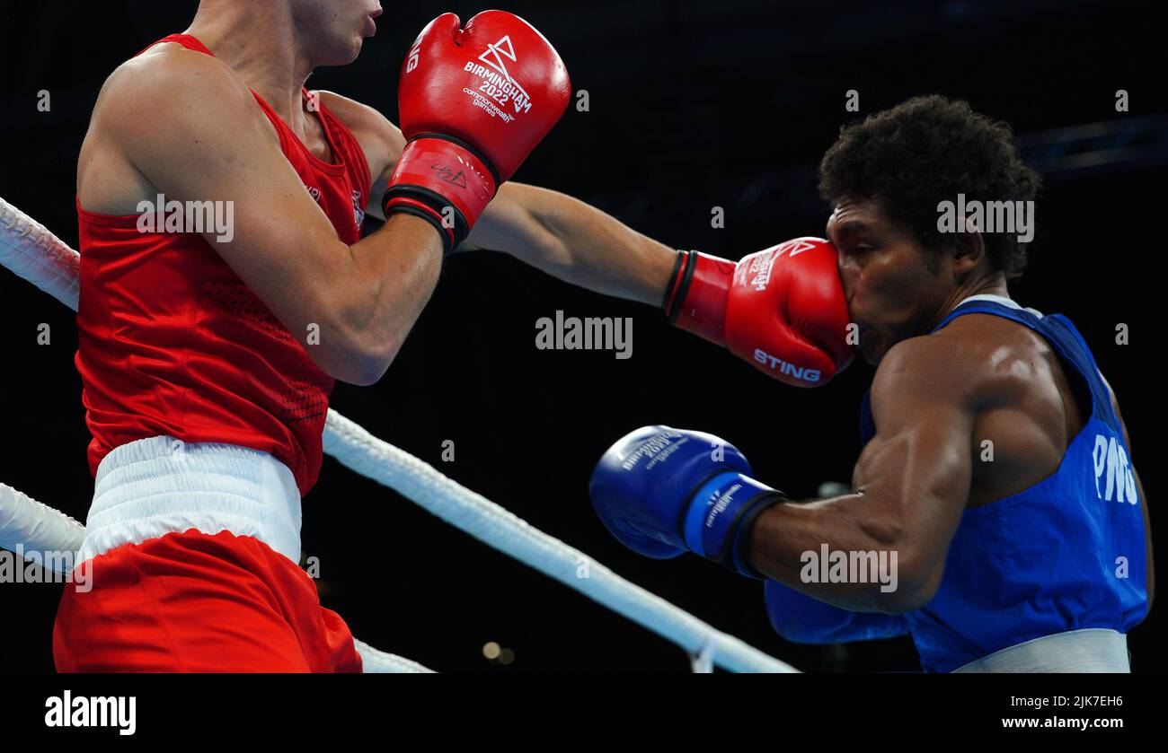 John Ume (Blue) from Papua New Guinea and England's Joseph Tyers (Red ...