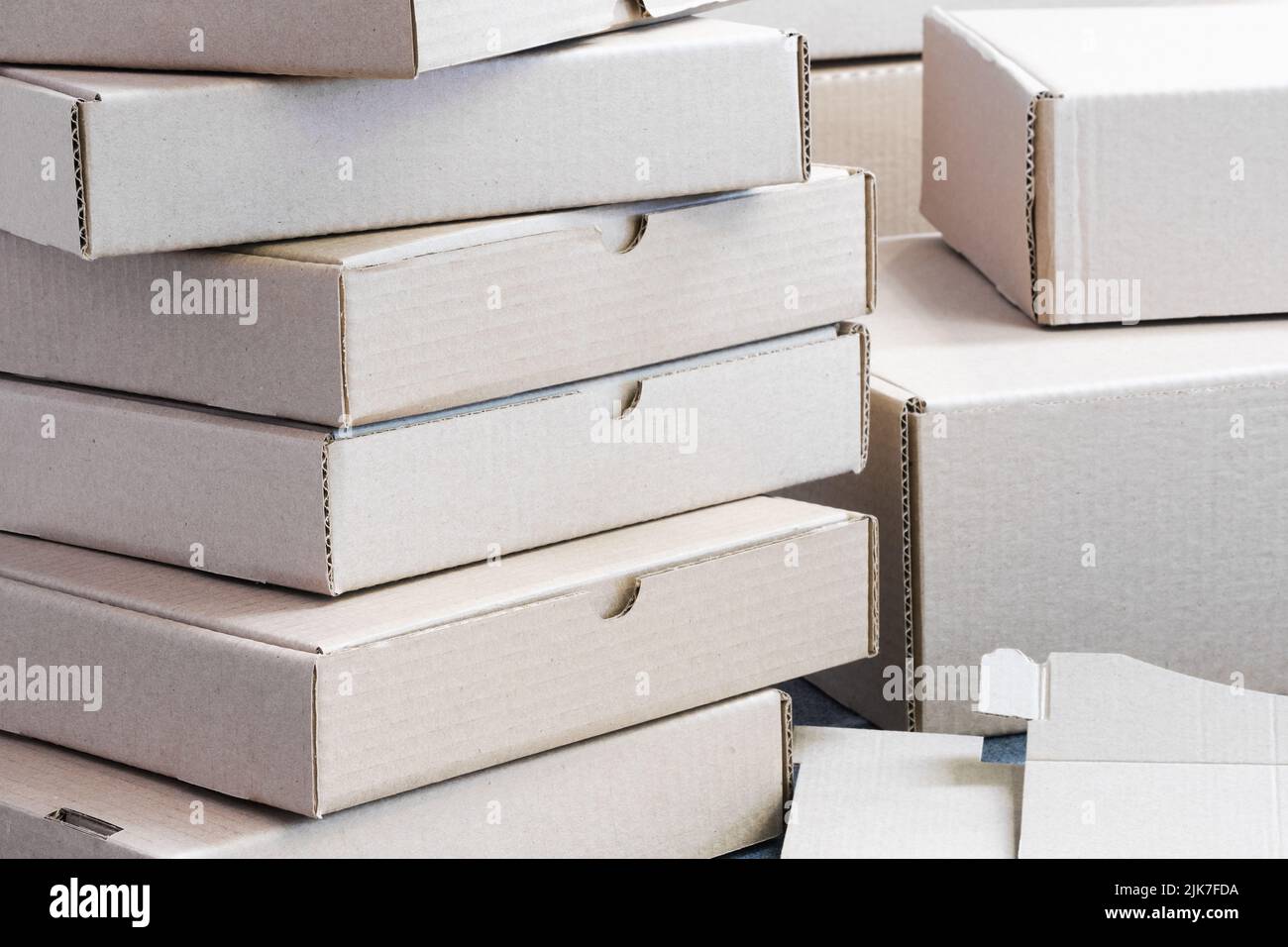 Stack of empty cardboard boxes for packaging close-up Stock Photo - Alamy