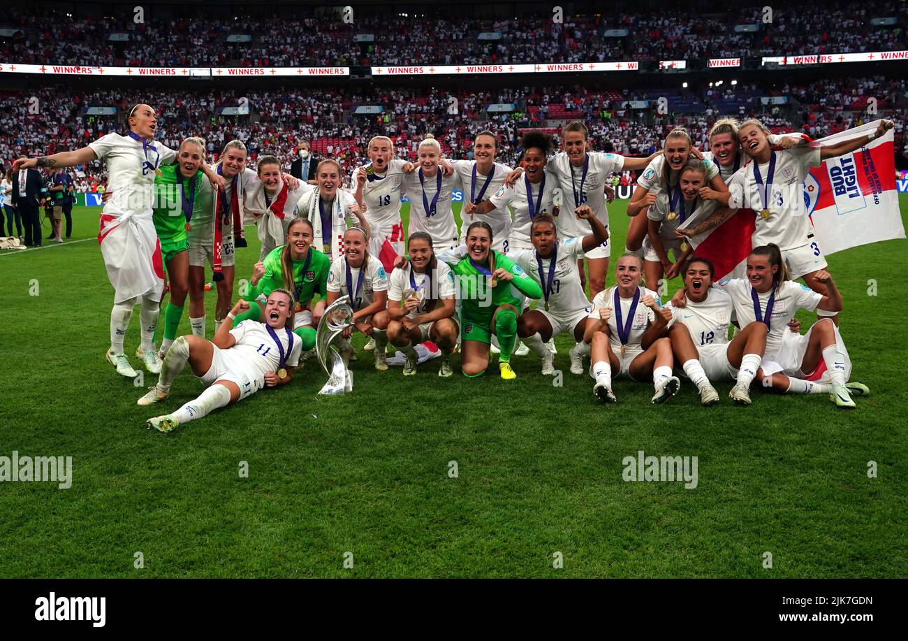 England players celebrate with the trophy following victory over ...