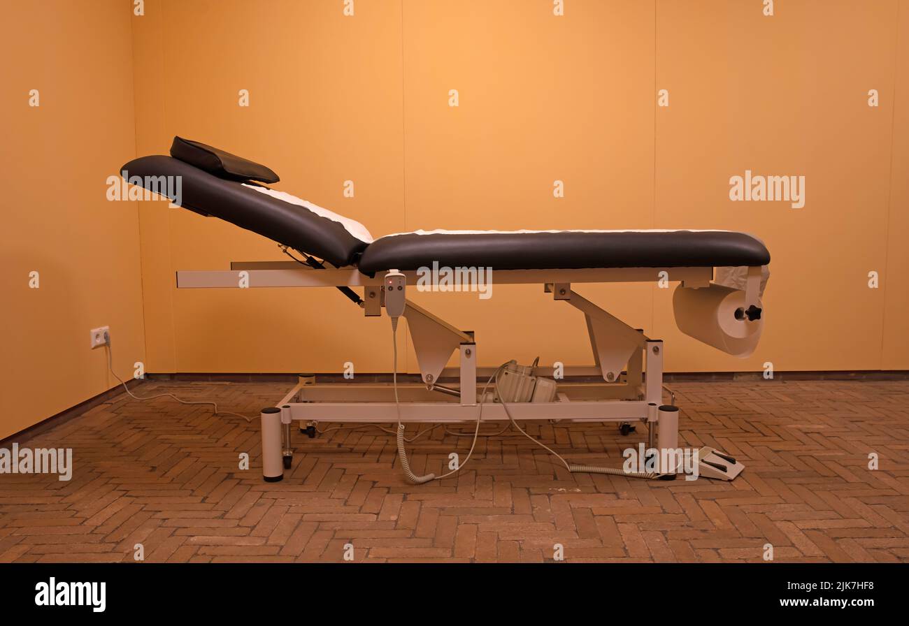 Examination room in a medical clinic, adjustable bed Stock Photo - Alamy