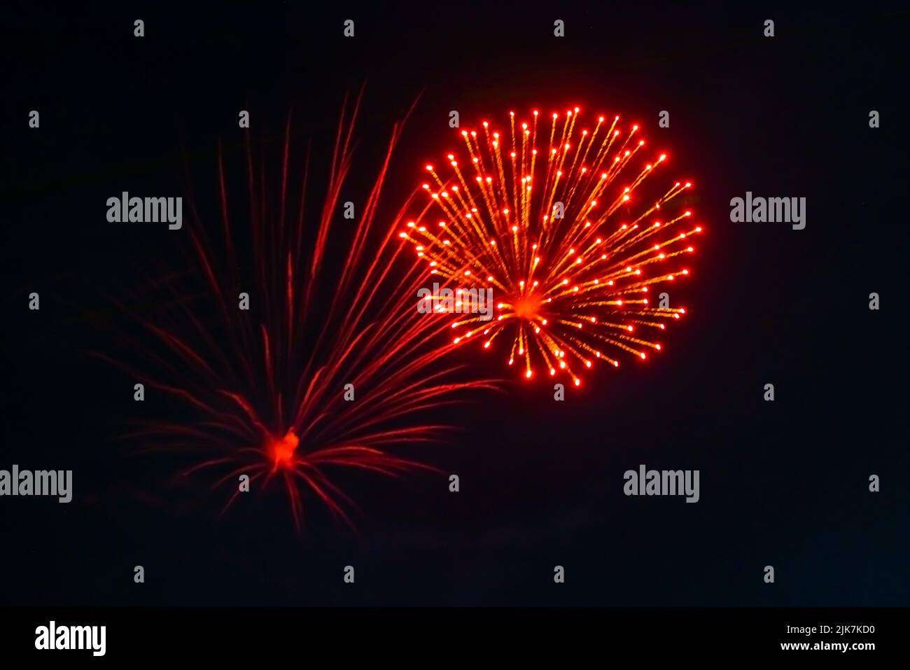 Bright, beautiful red fireworks in the night sky. High quality photo ...