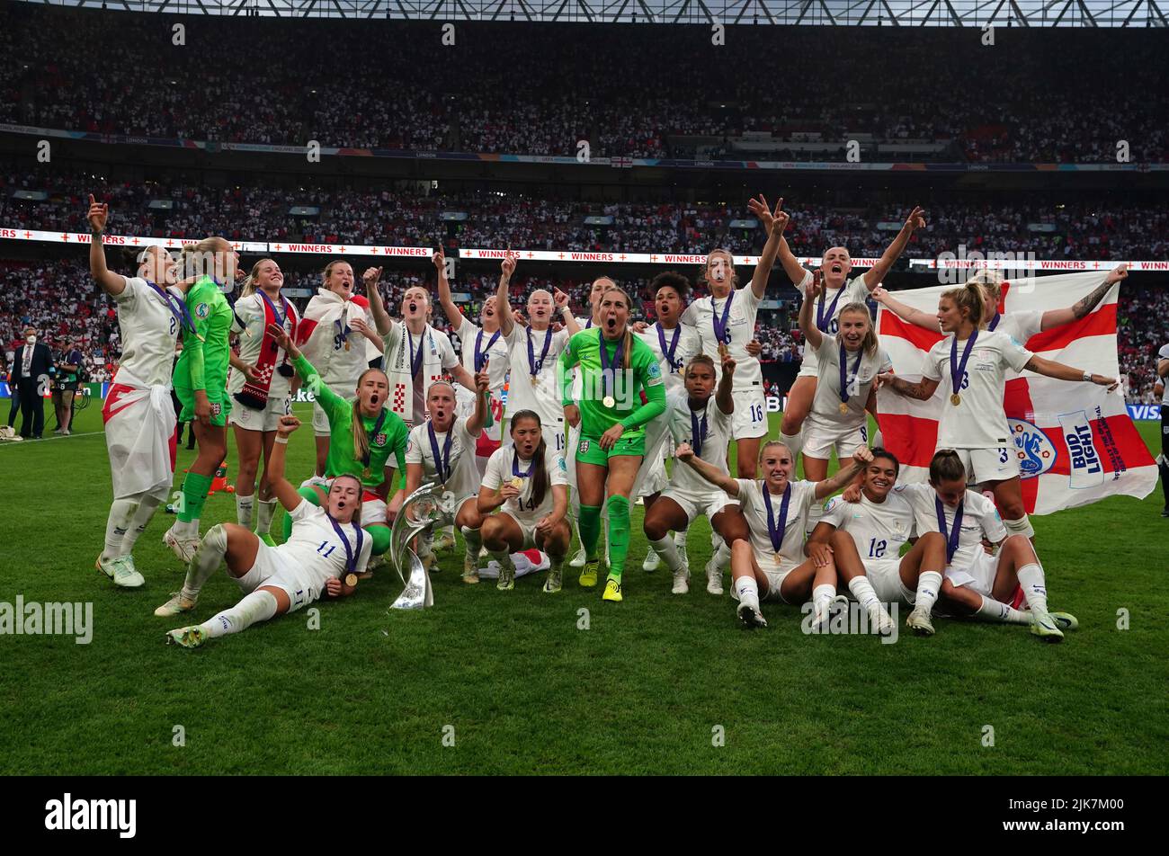 England players celebrate with the trophy following victory over ...