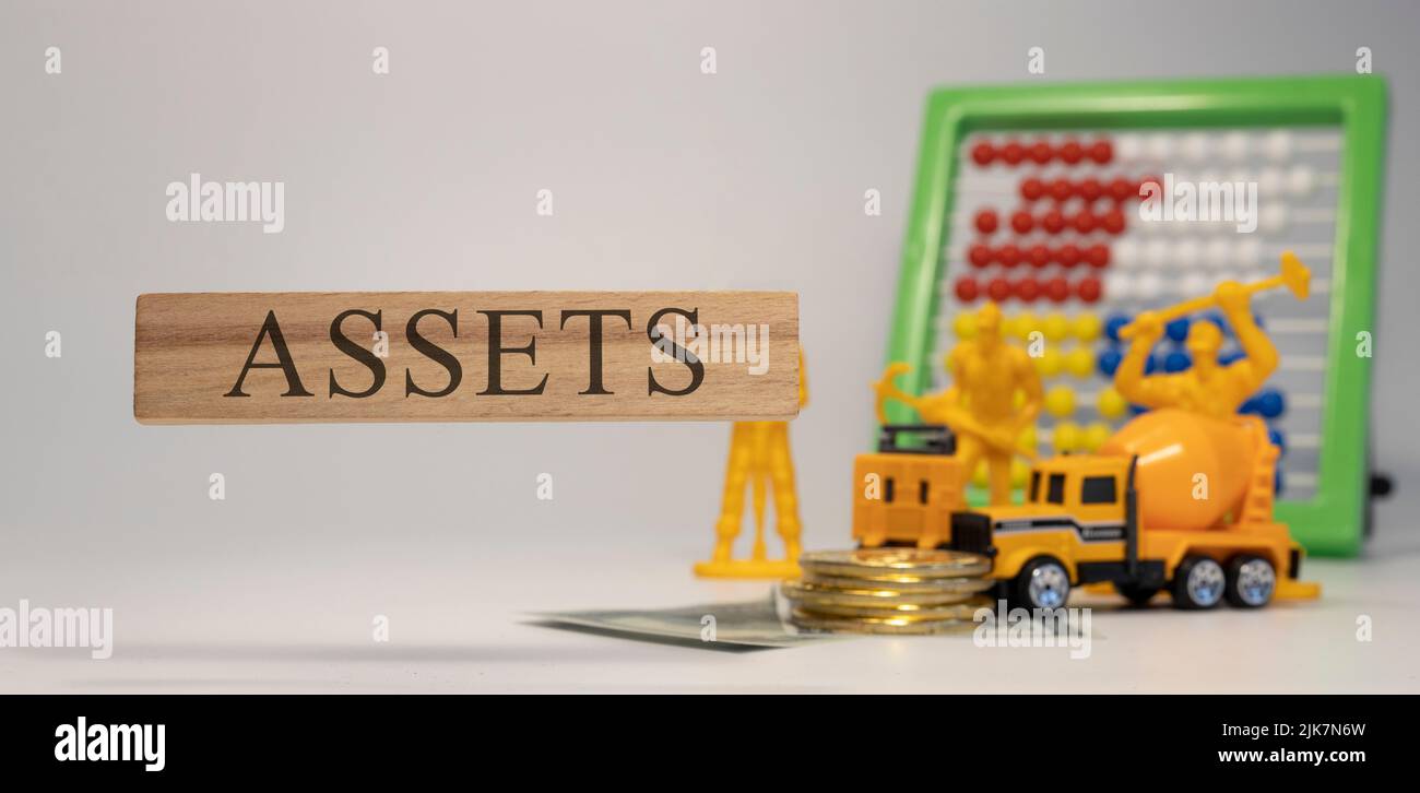 Asset sentence written on wooden surface. Economy and concept Stock ...