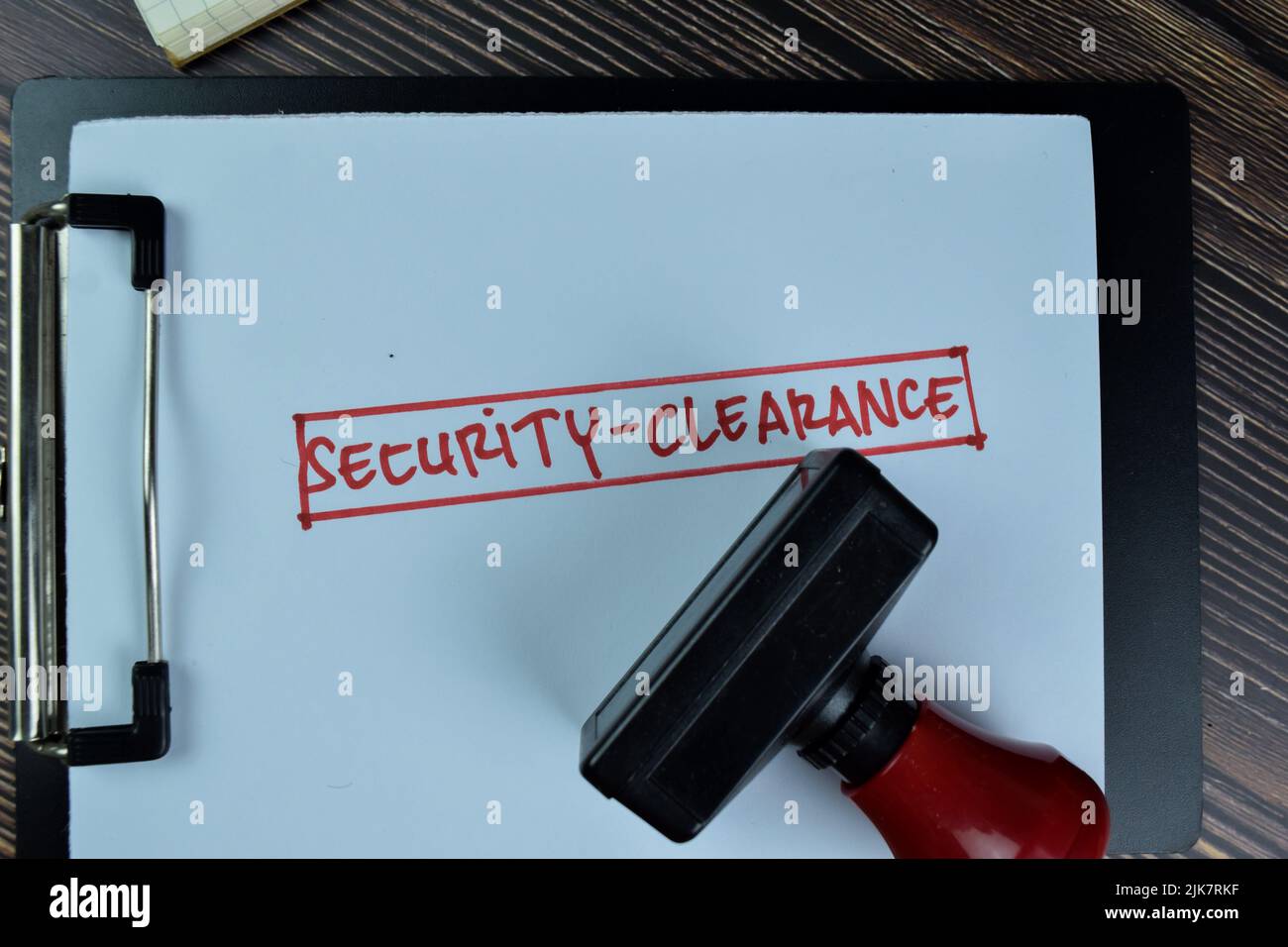 Concept of Security-Clearance write on a paperwork isolated on Wooden ...