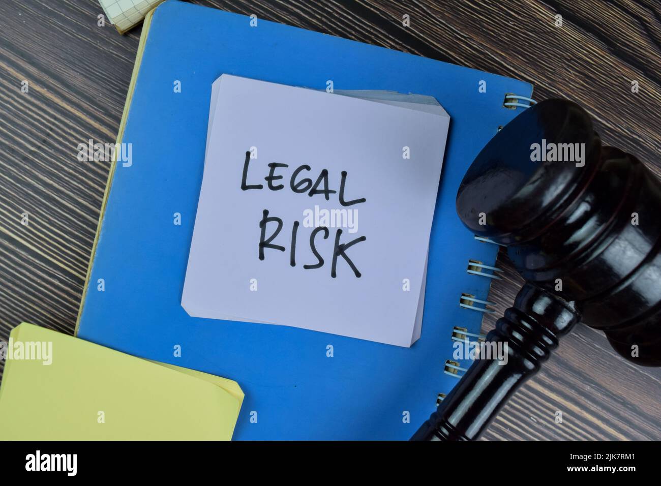 Concept of Legal Risk write on sticky notes with gavel isolated on ...