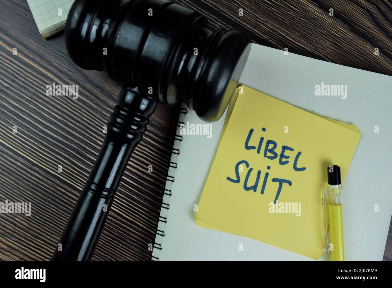 Concept of Libel Suit write on sticky notes with gavel isolated on ...