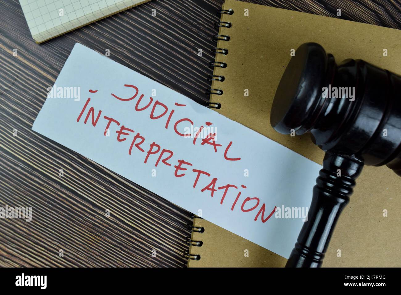 Concept of Judicial Interpretation write on sticky notes with gavel ...