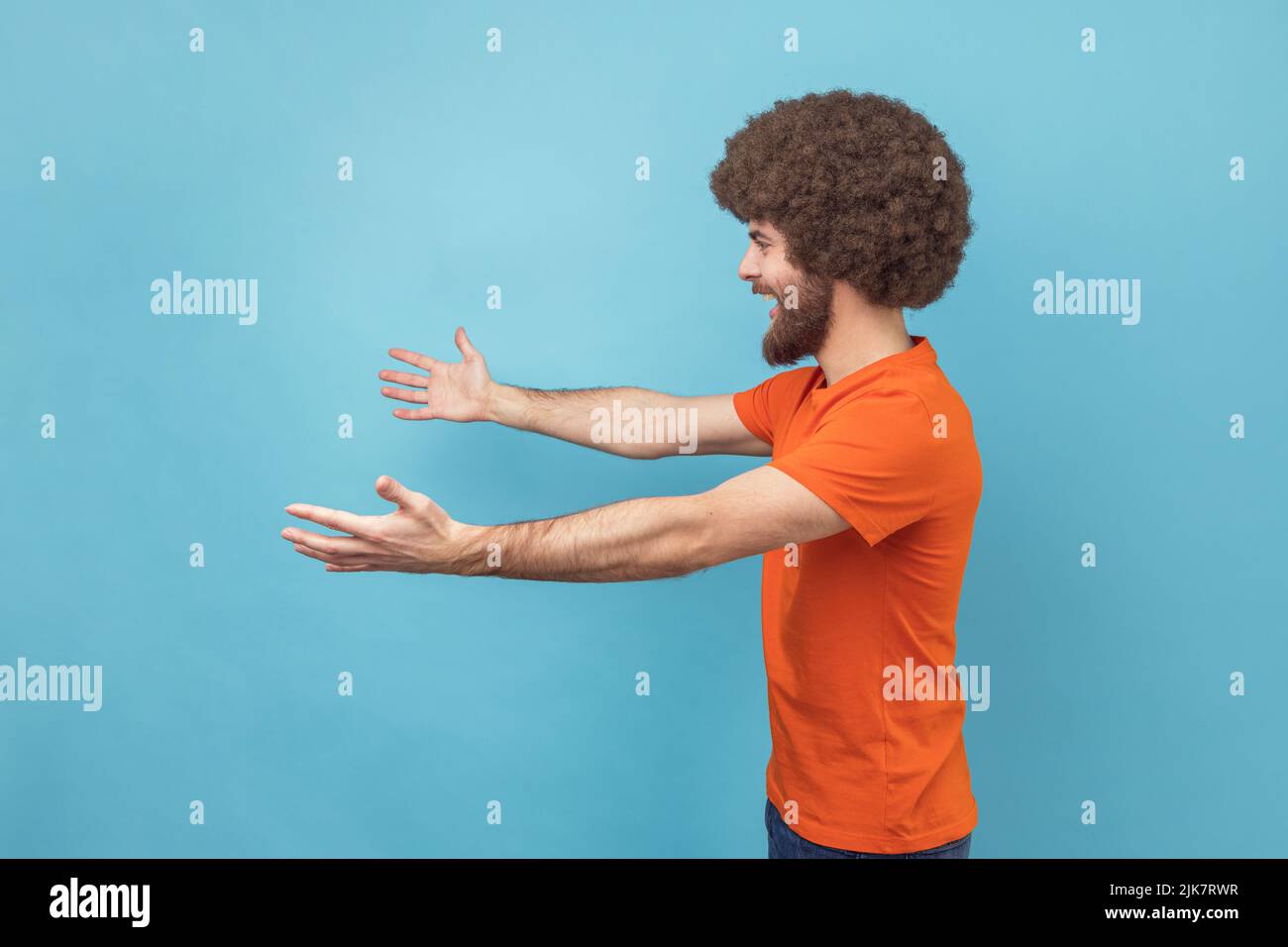 Come into my arms. Side view of satisfied man with Afro hairstyle ...