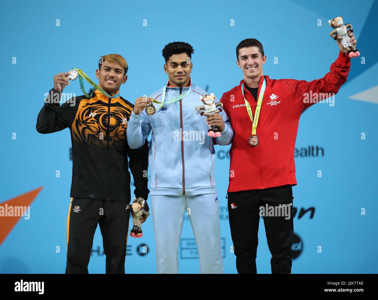 India’s Achinta Sheuli celebrates with his Gold Medal following the Men ...