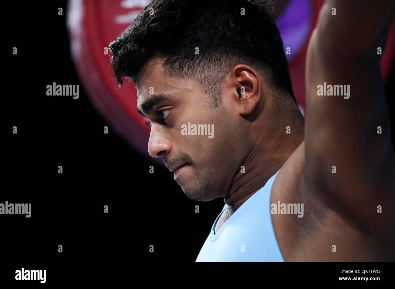 India’s Achinta Sheuli celebrates with his Gold Medal following the Men ...