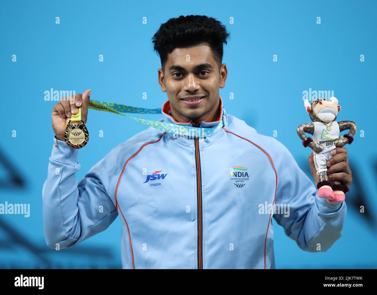 India’s Achinta Sheuli celebrates with his Gold Medal following the Men ...