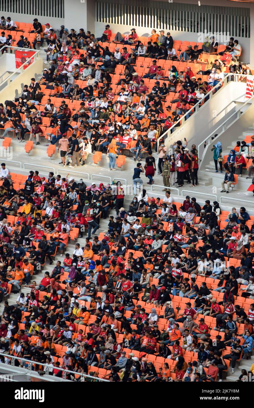 Crowds on Group of fans on the stadium Jakarta International Stadium ...