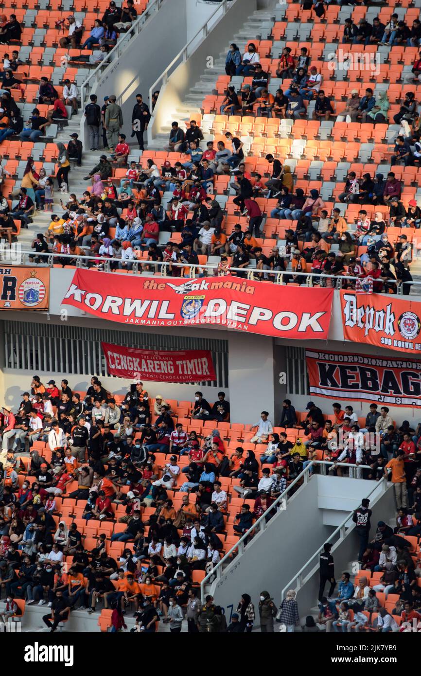 Crowds on Group of fans on the stadium Jakarta International Stadium ...