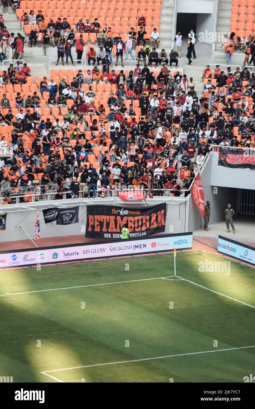 Crowds on Group of fans on the stadium Jakarta International Stadium ...