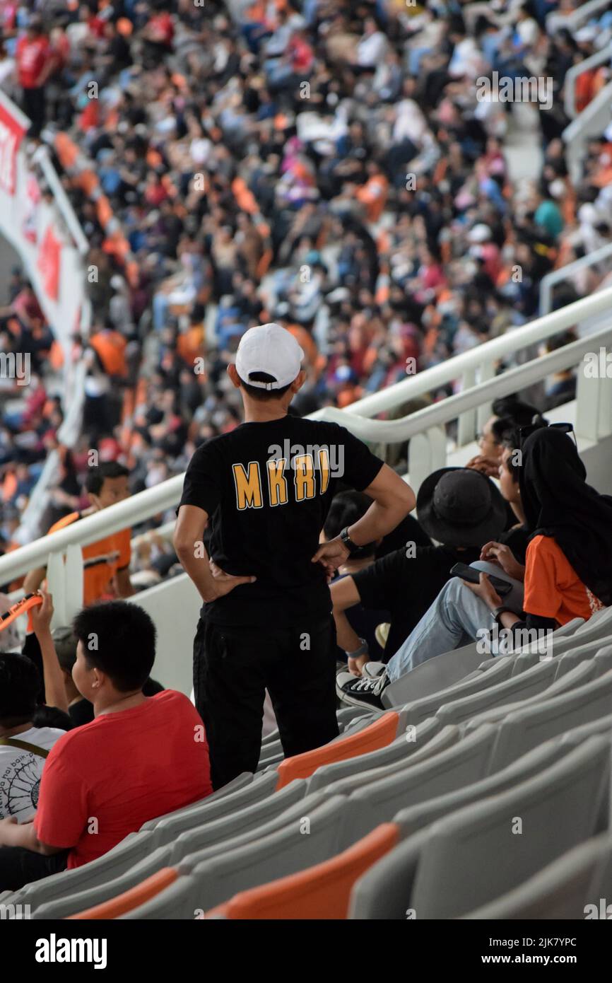 Crowds on Group of fans on the stadium Jakarta International Stadium ...