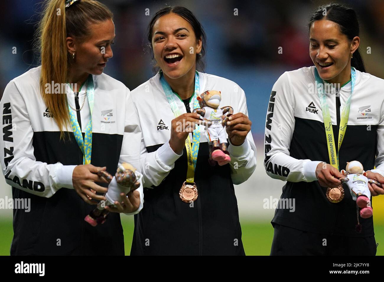 New Zealand's Stacey Fluhler (centre) and team-mates with their bronze ...