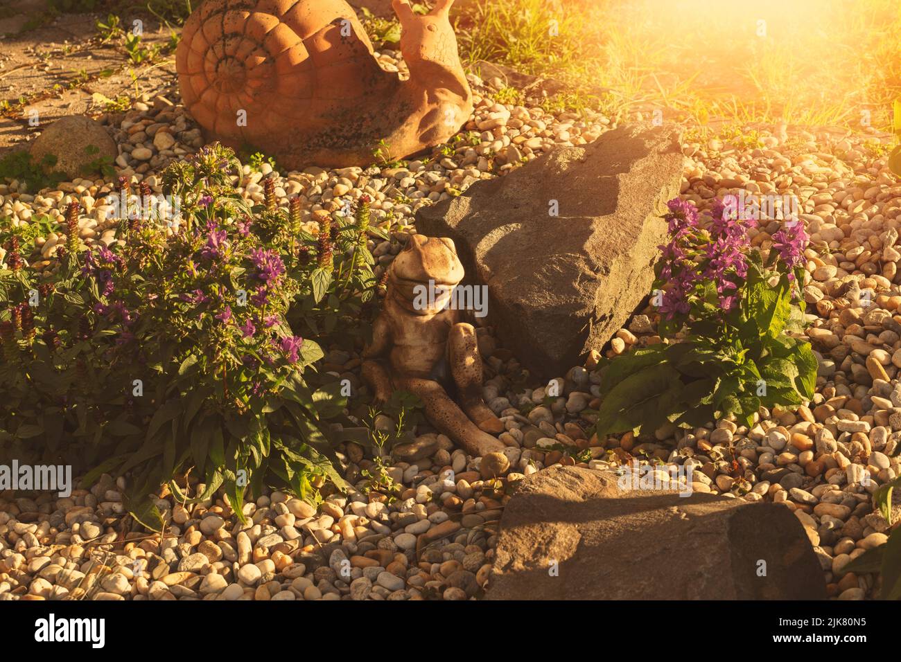 Decorated colorful flowerbed with stones as a decorative elements ...