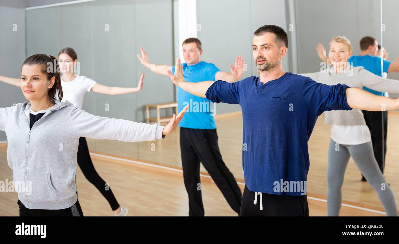 Females and males stretching at dance class Stock Photo - Alamy