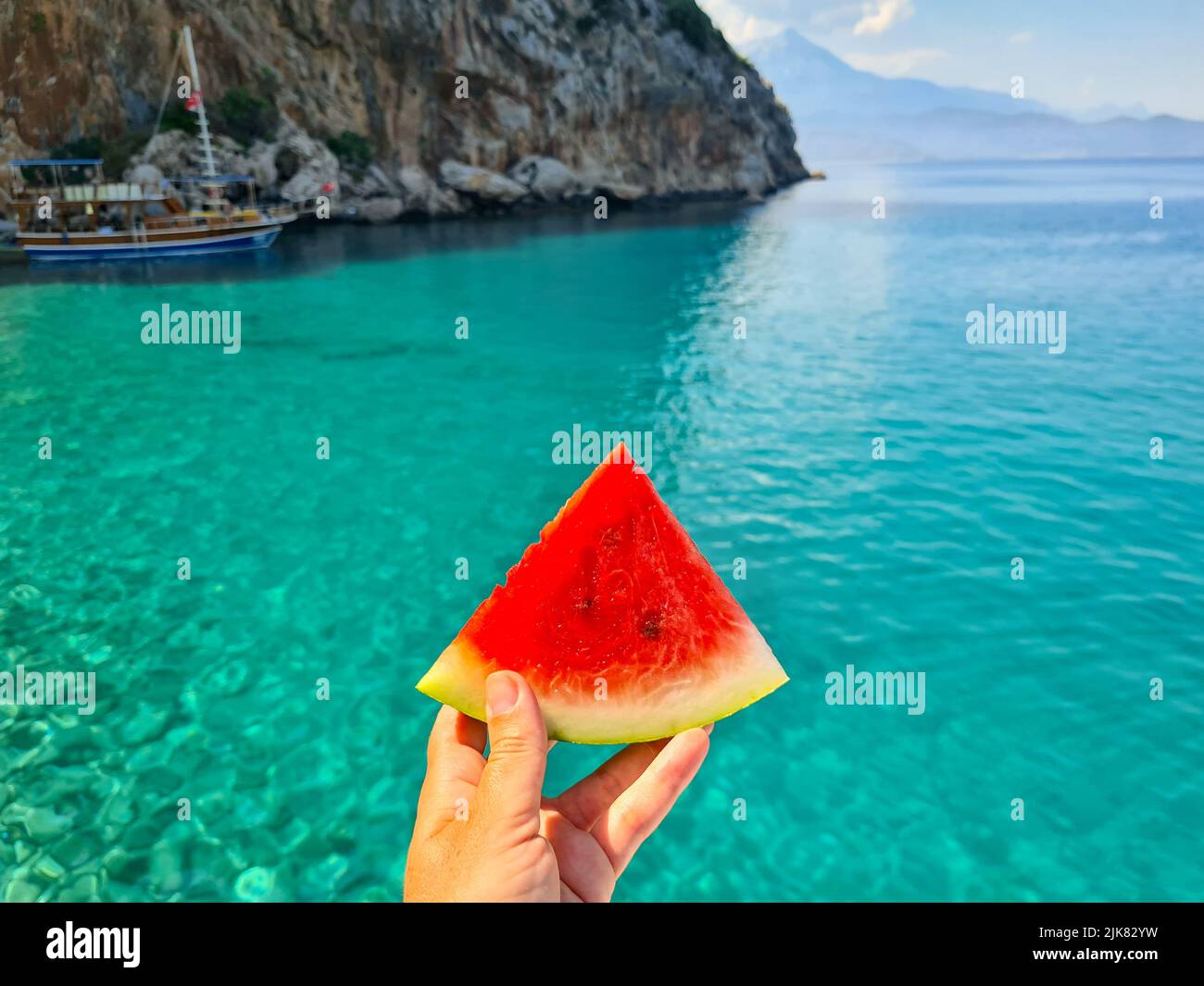 Bright red watermelon on blue sea background Stock Photo - Alamy