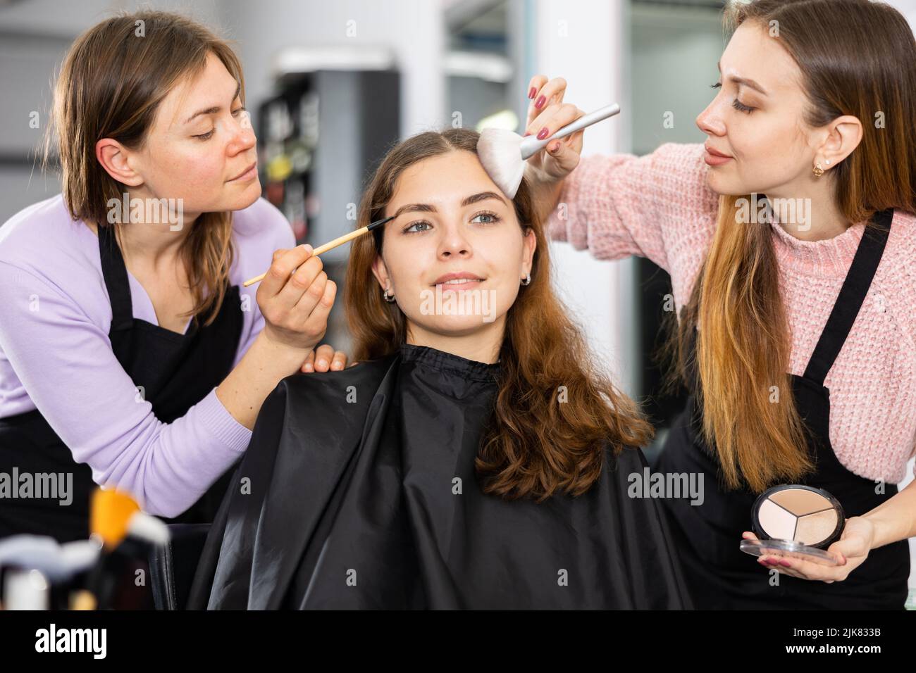 Two professional makeup artists hi-res stock photography and images - Alamy