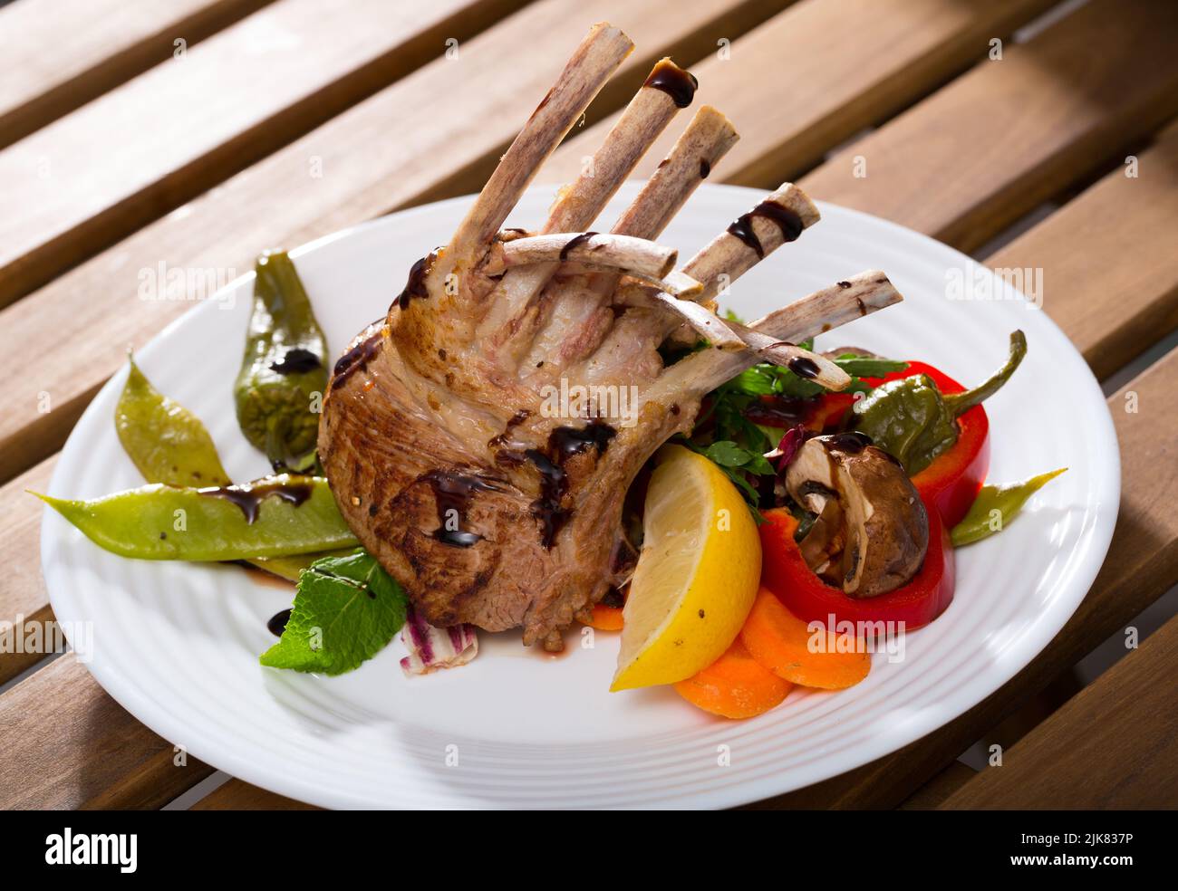 Roasted rack of mutton with vegetables Stock Photo - Alamy