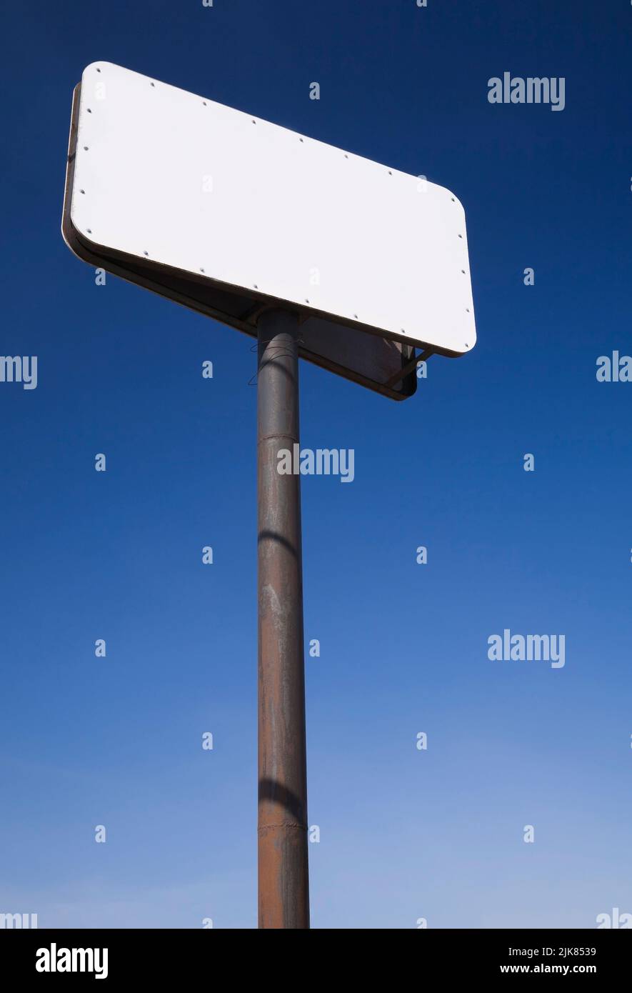 Blank white advertising sign on a steel post Stock Photo - Alamy