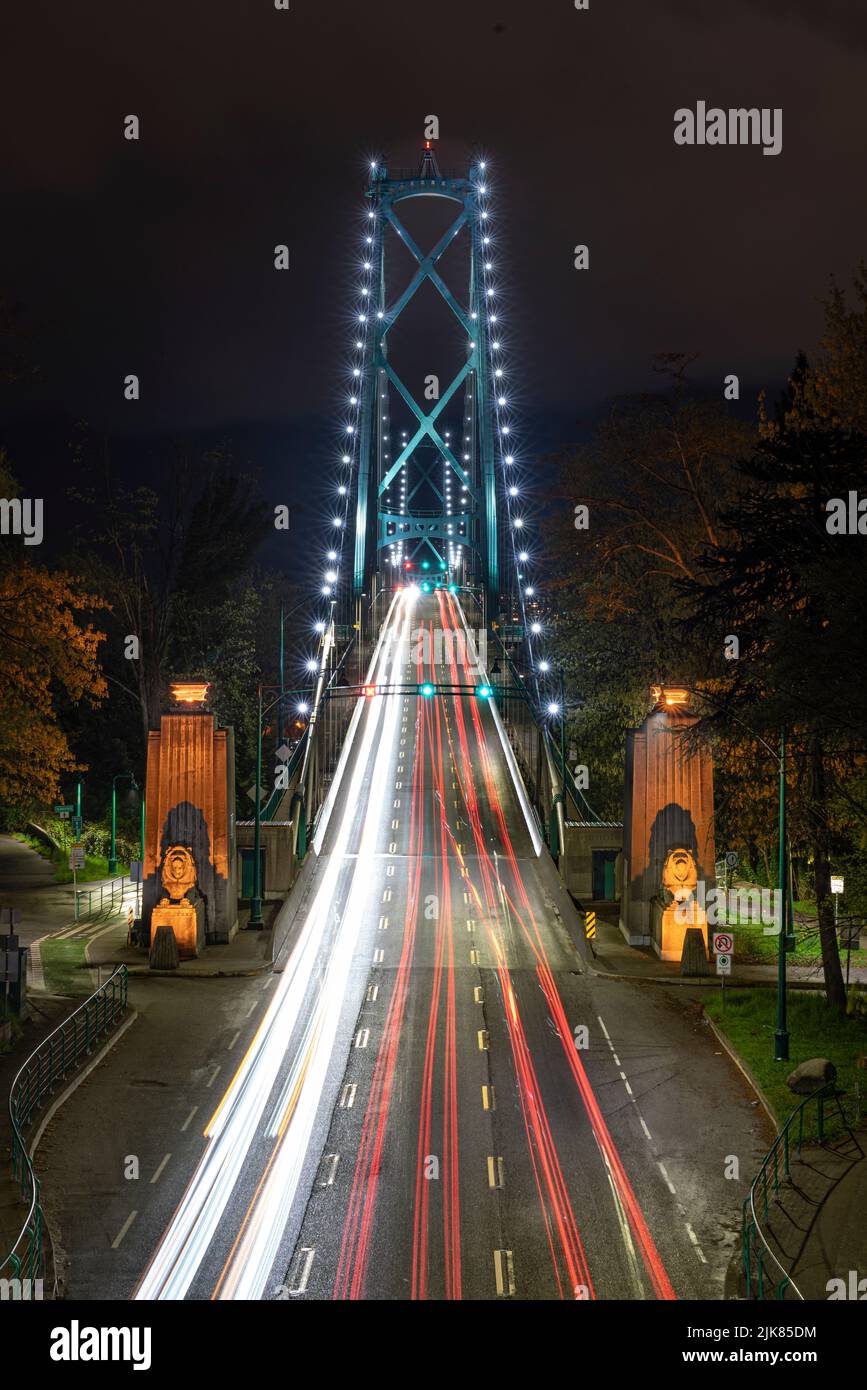 The Lions Gate Bridge illuminated at night in Vancouver, British ...