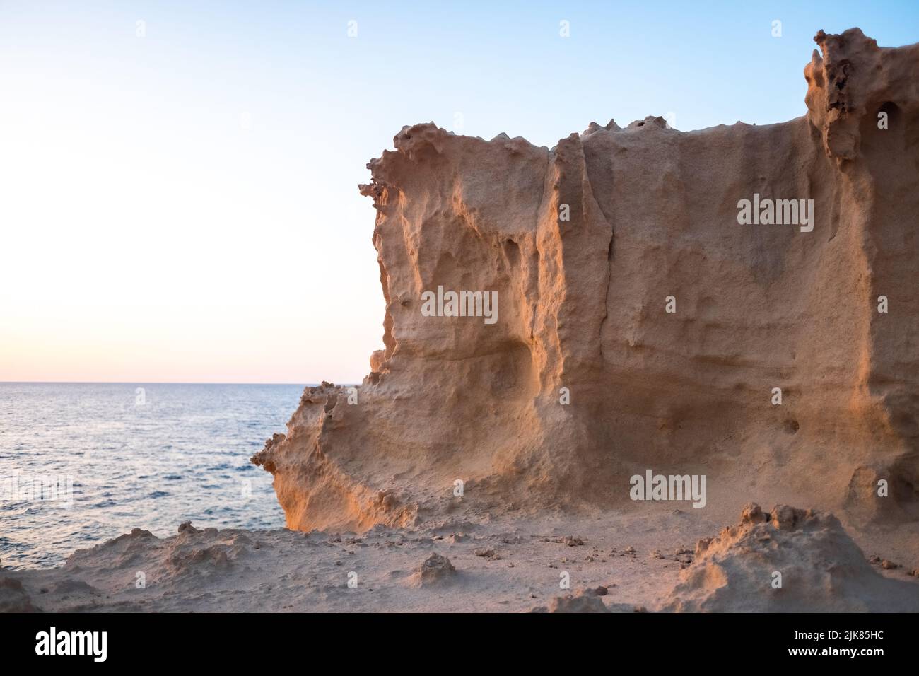 Limestone cliffs debris from erosion turns into white beach sand Stock ...
