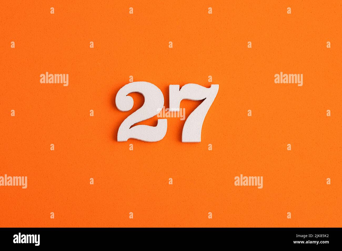 Number 27 - On orange foam rubber background Stock Photo - Alamy
