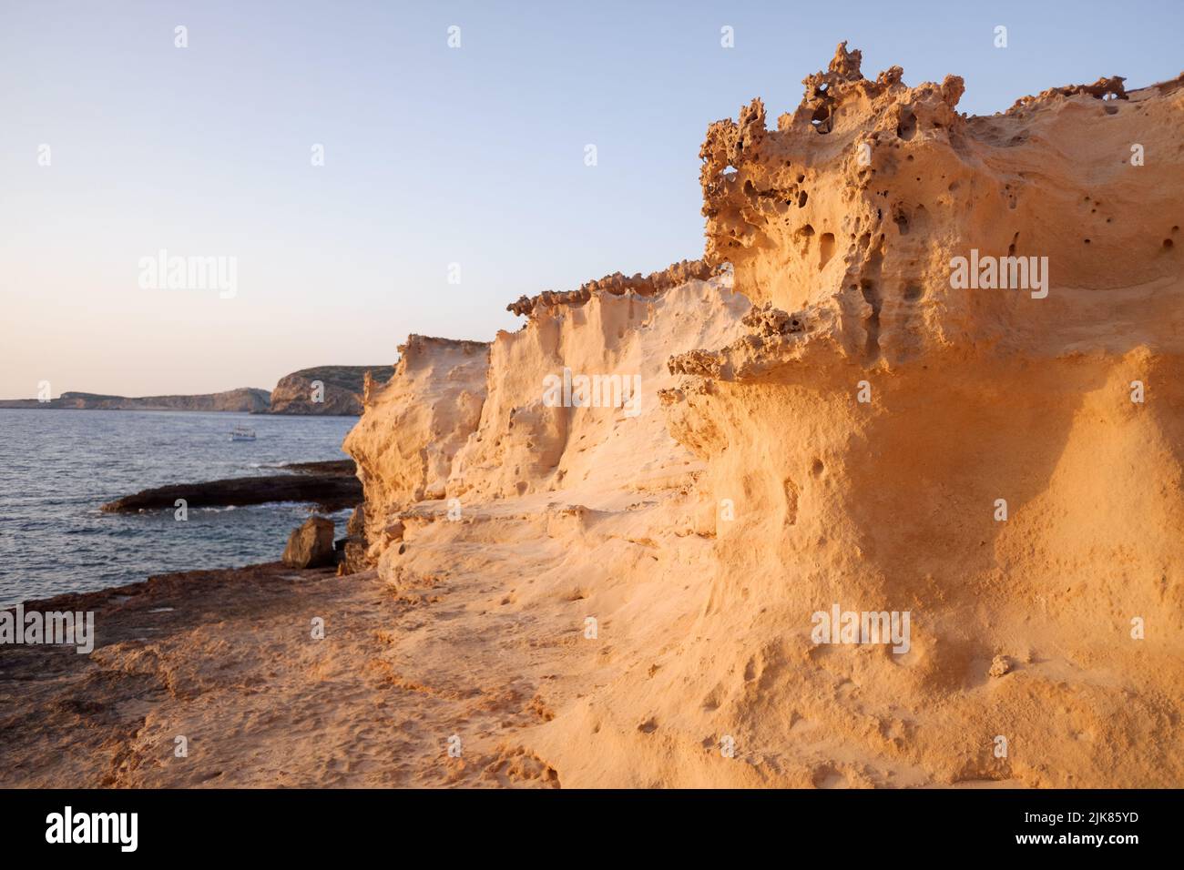 Limestone cliffs debris from erosion turns into white beach sand Stock ...
