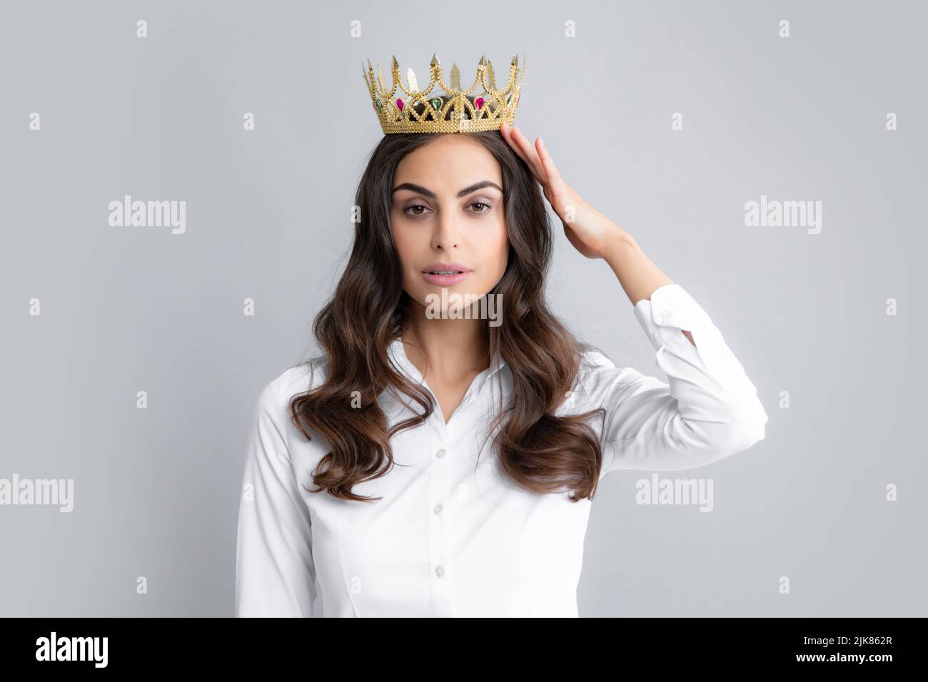 Portrait of arrogance woman with golden crown on head, leadership and ...
