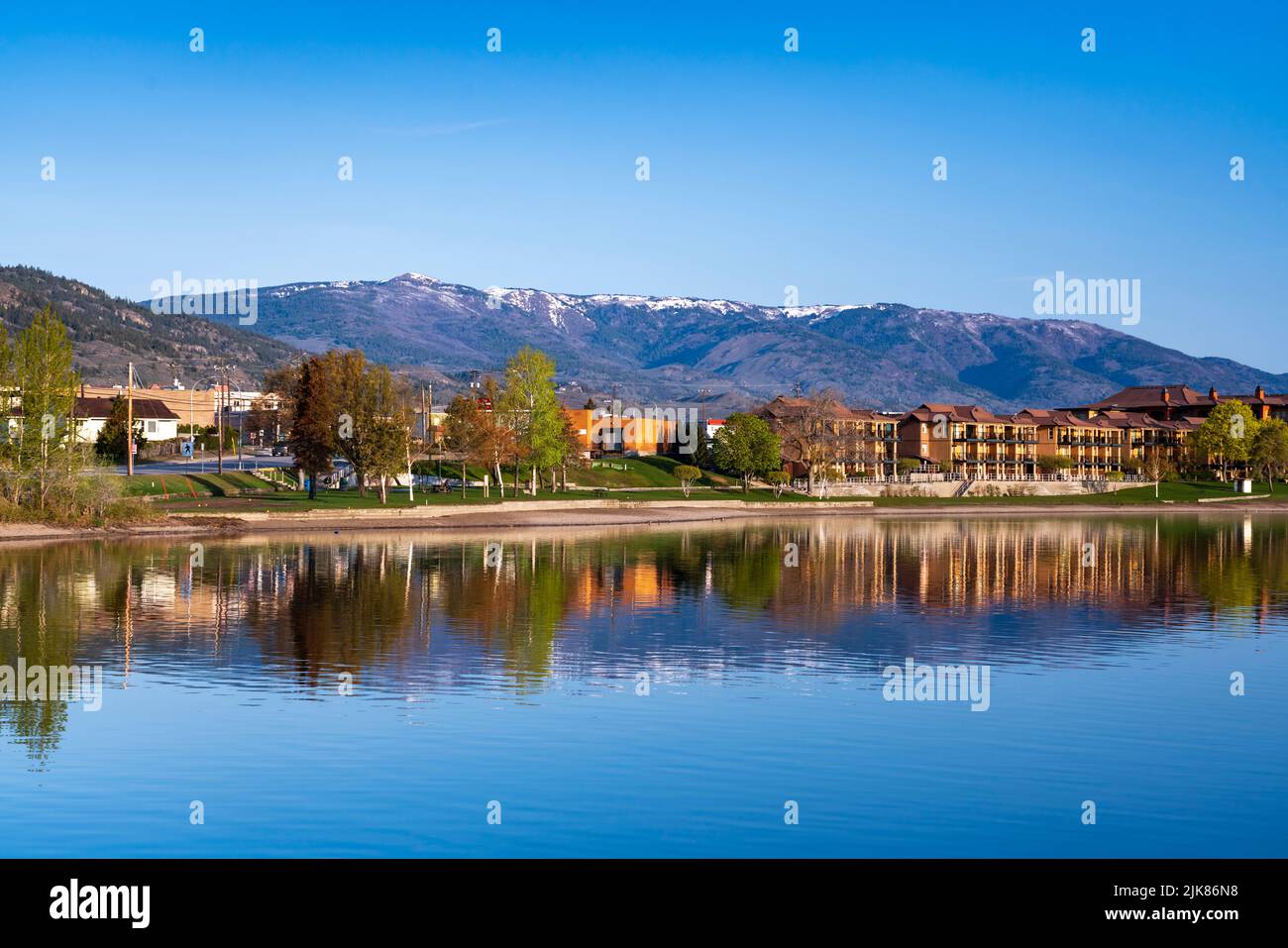 Reflection on a calm Osoyoos Lake, British Columbia, Canada Stock Photo ...