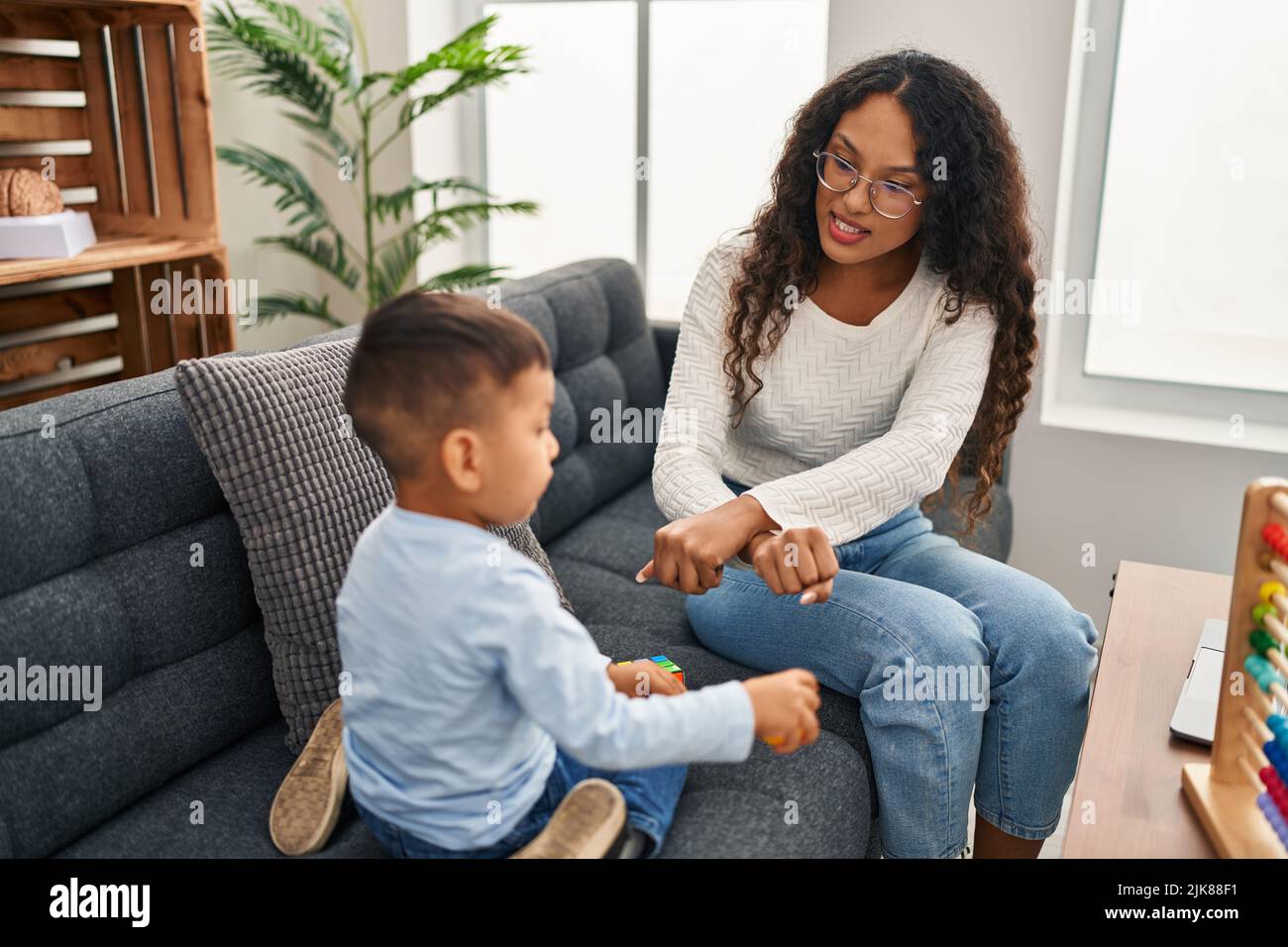 Mother and son having educational therapy at pedagogue center Stock ...